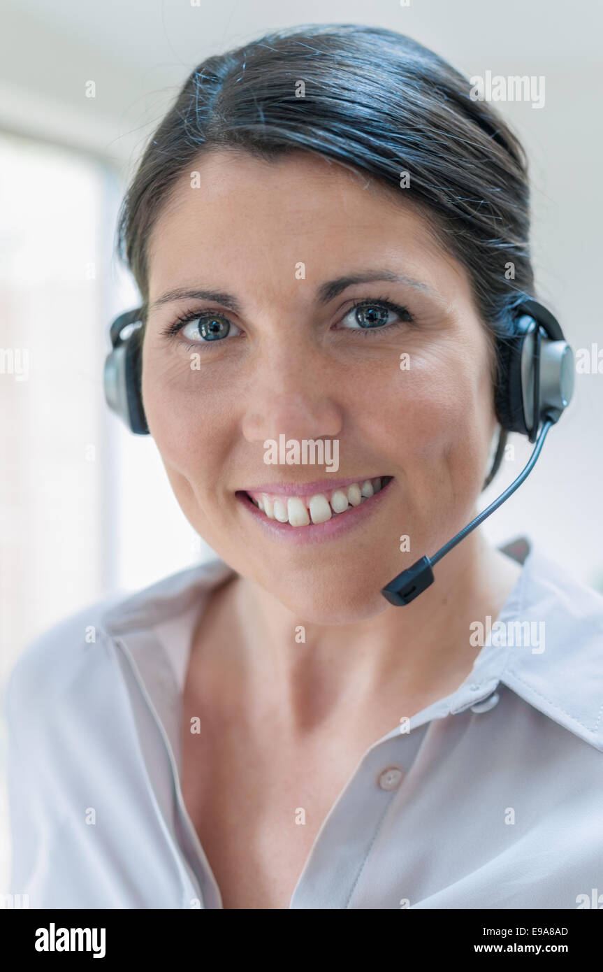 Customer Service Representative talking on headset Stock Photo - Alamy
