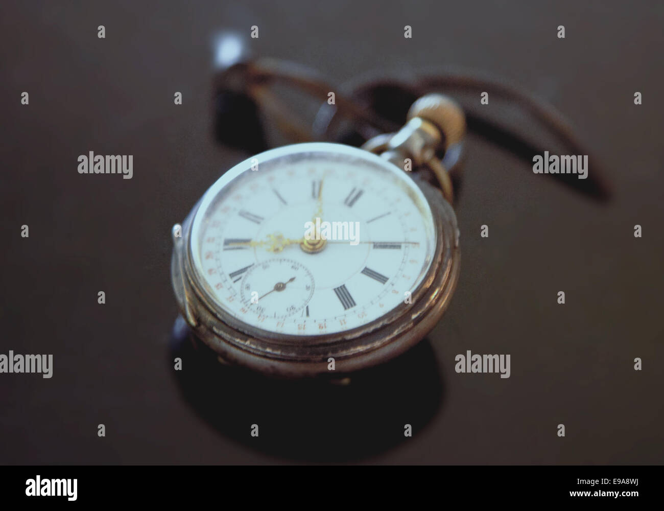 Pocket clock in gold Stock Photo - Alamy