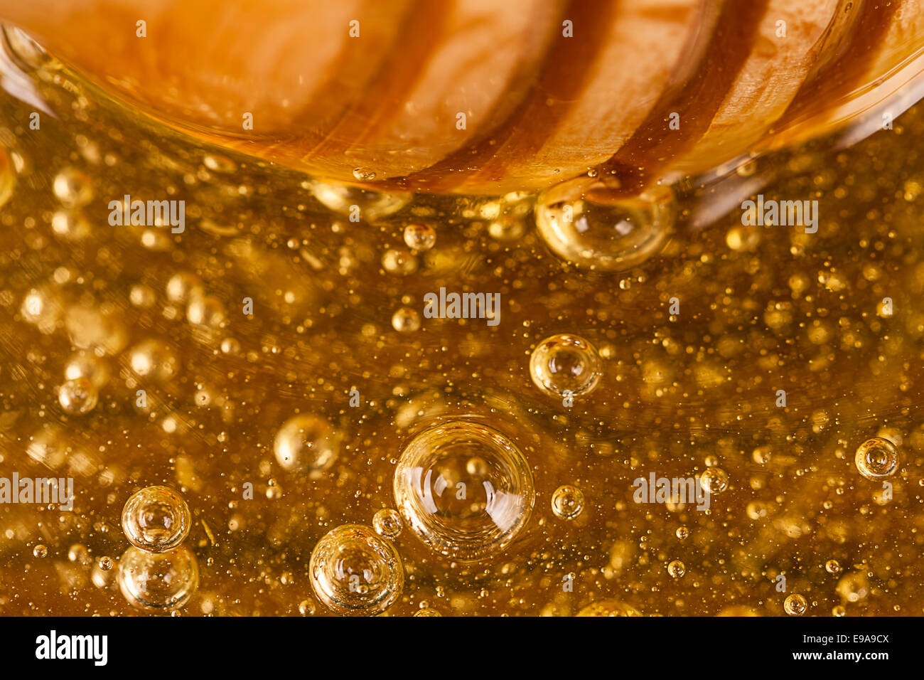 Honey with bubbles Stock Photo - Alamy
