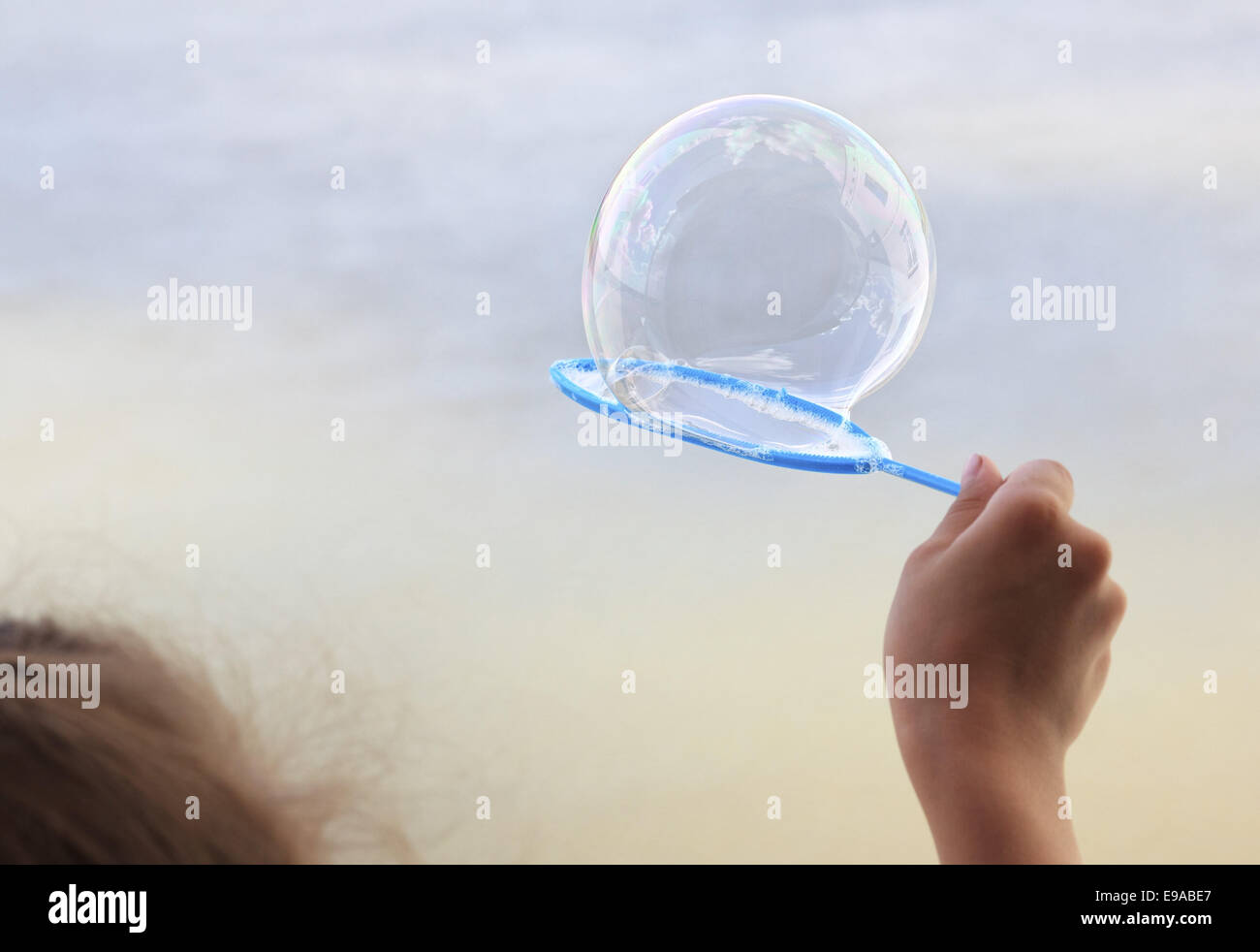 Children's hand with a soap bubble Stock Photo - Alamy
