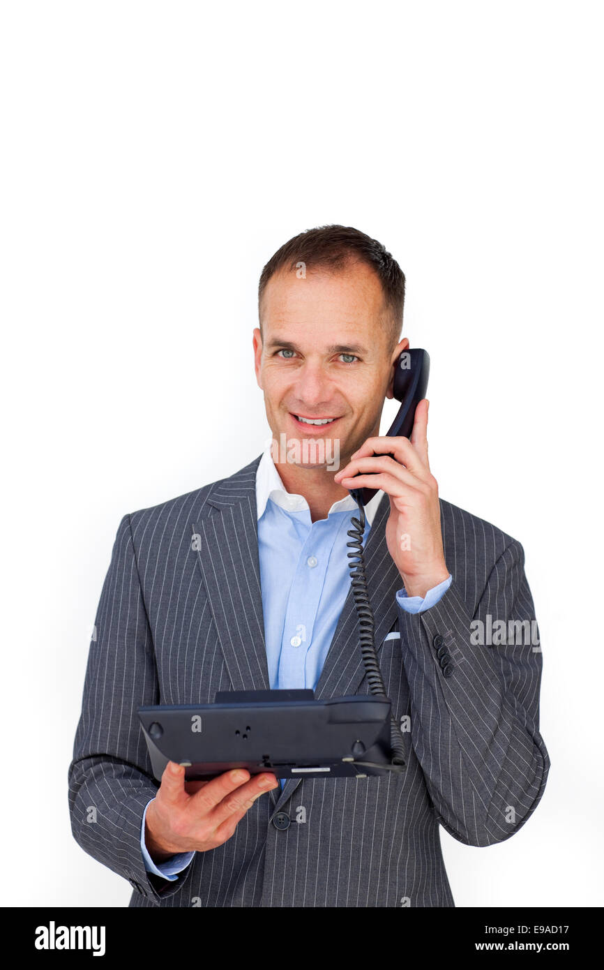 Smiling businessman using a phone Stock Photo - Alamy