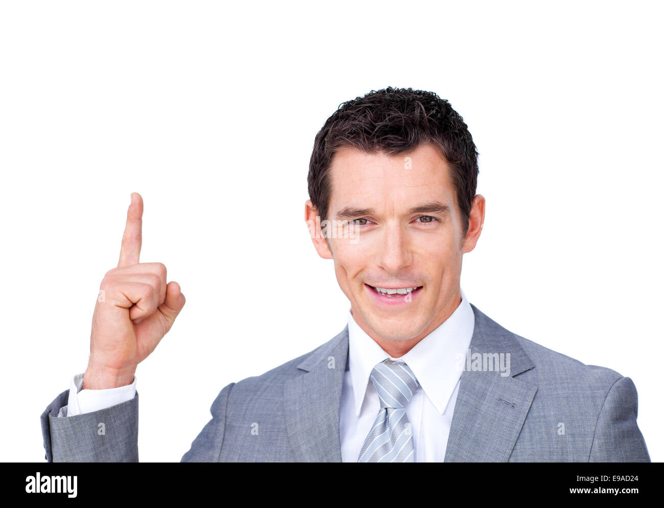 Confident businessman pointing upward Stock Photo - Alamy