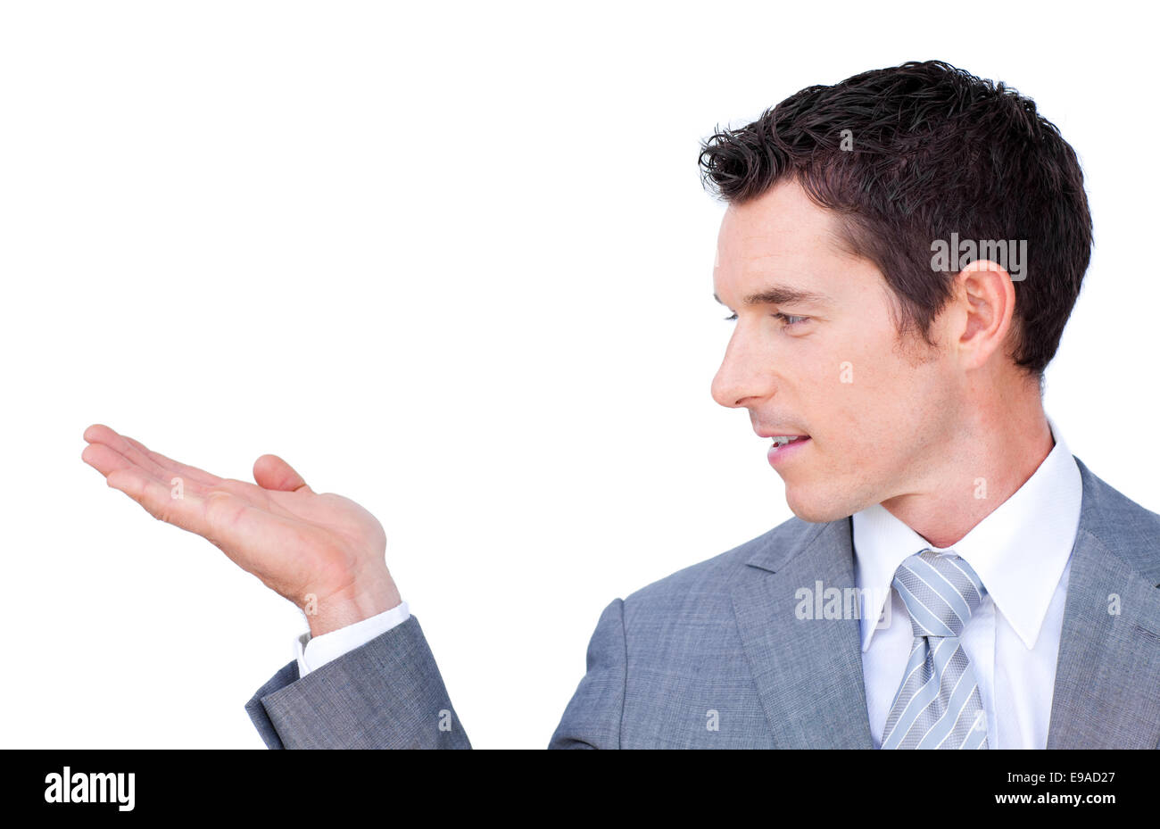 Assertive businessman presenting Stock Photo - Alamy