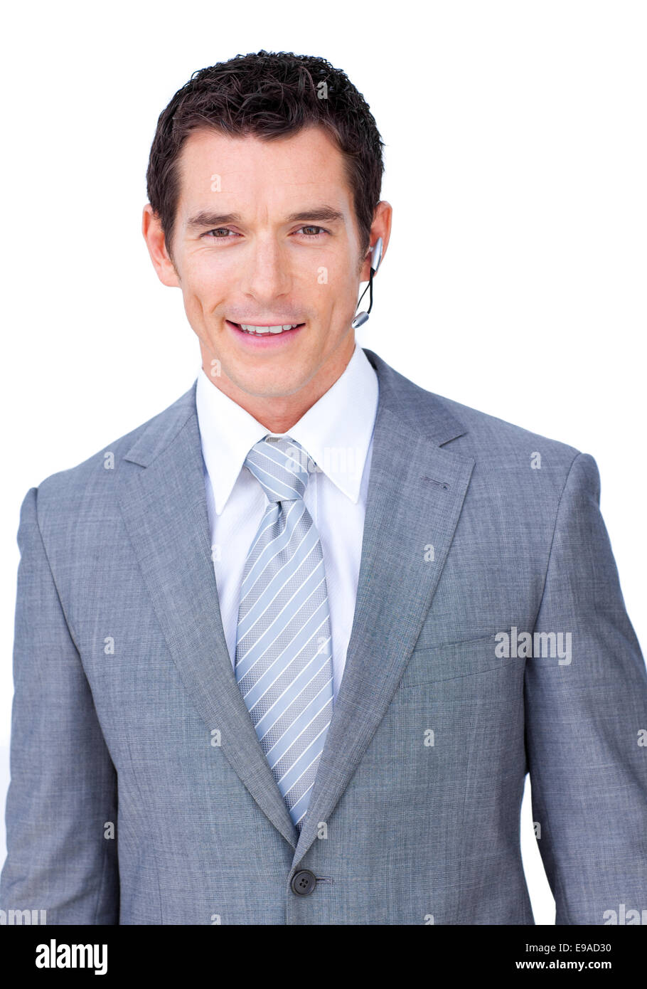 Confident male executive with headset on Stock Photo - Alamy