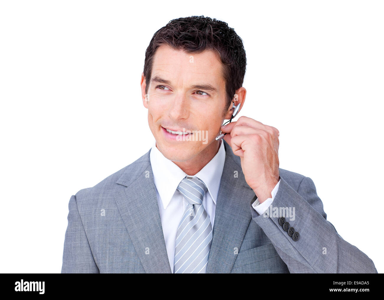 Positive customer service agent using headset Stock Photo - Alamy
