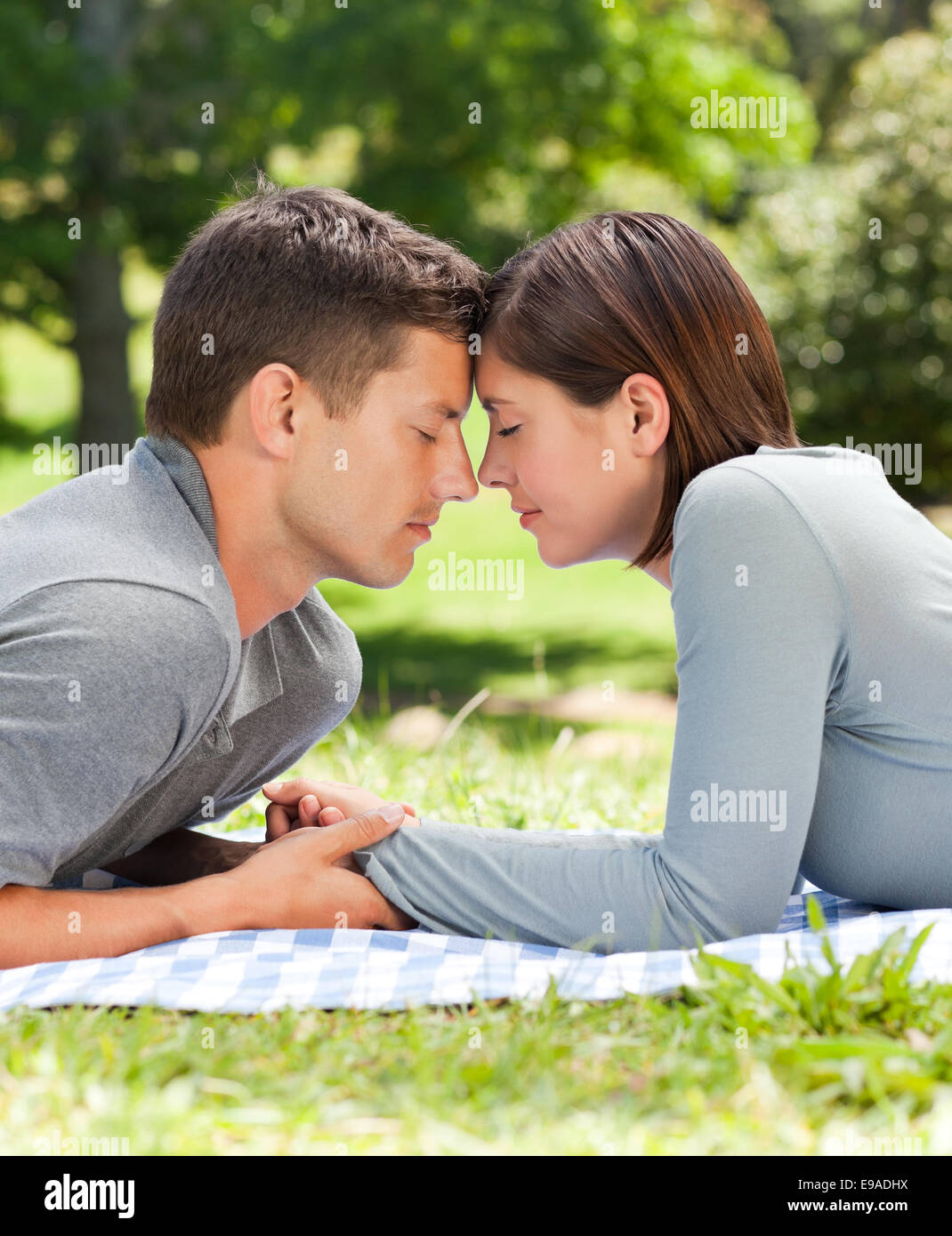 Enamored couple in the park Stock Photo - Alamy