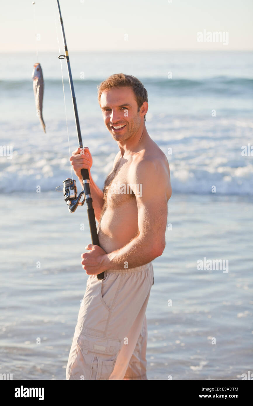 Active man fishing Stock Photo - Alamy