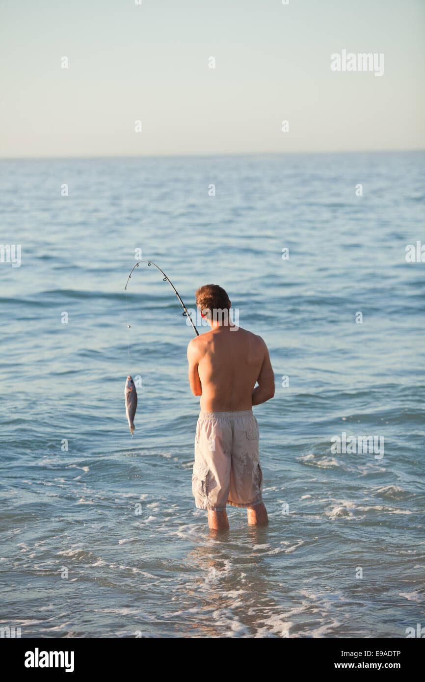 Active man fishing Stock Photo - Alamy