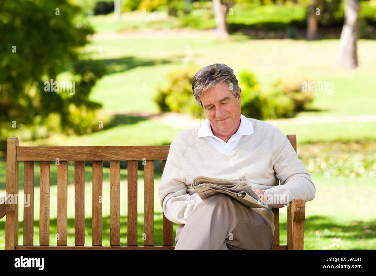 Man reading a newspaper Stock Photo - Alamy