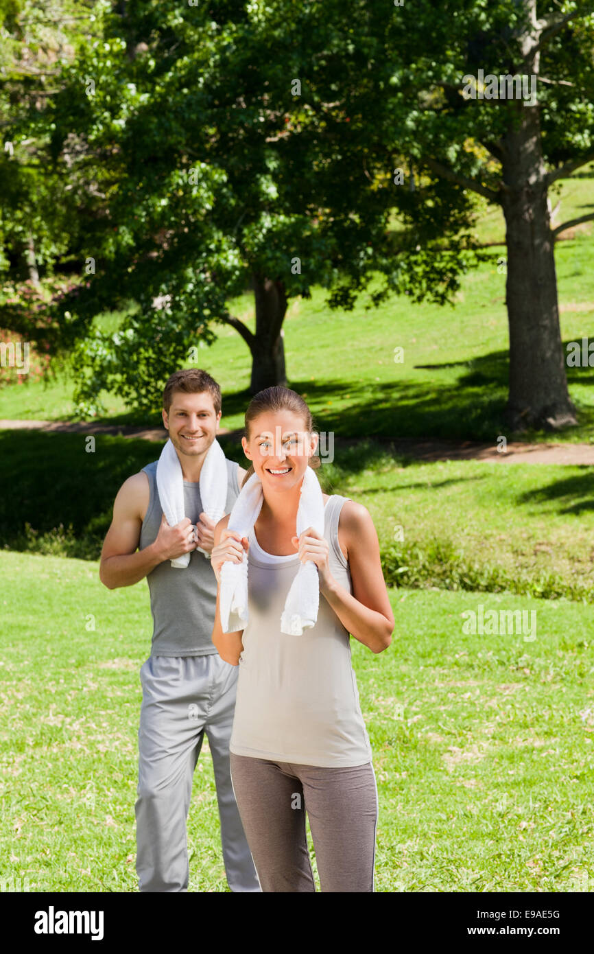 Exhausted couple in the park Stock Photo - Alamy