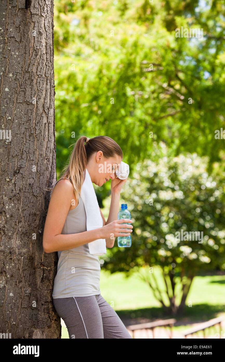 Tired woman in the park Stock Photo - Alamy
