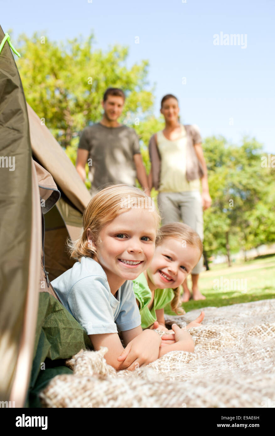 Happy family camping in the park Stock Photo - Alamy