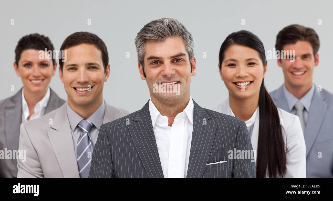 Multi-ethnic business team standing together Stock Photo - Alamy