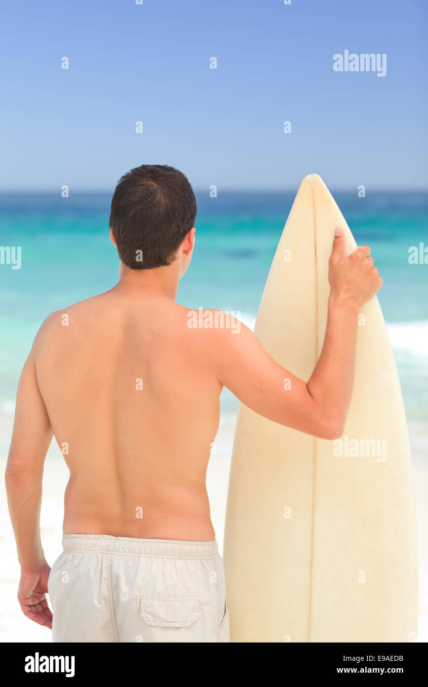 Man with his surfboard Stock Photo - Alamy