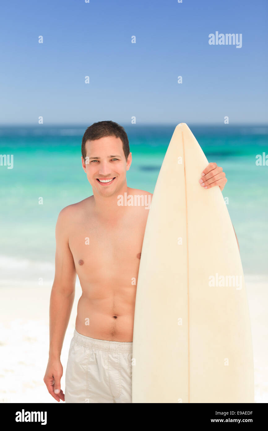 Man with his surfboard Stock Photo - Alamy