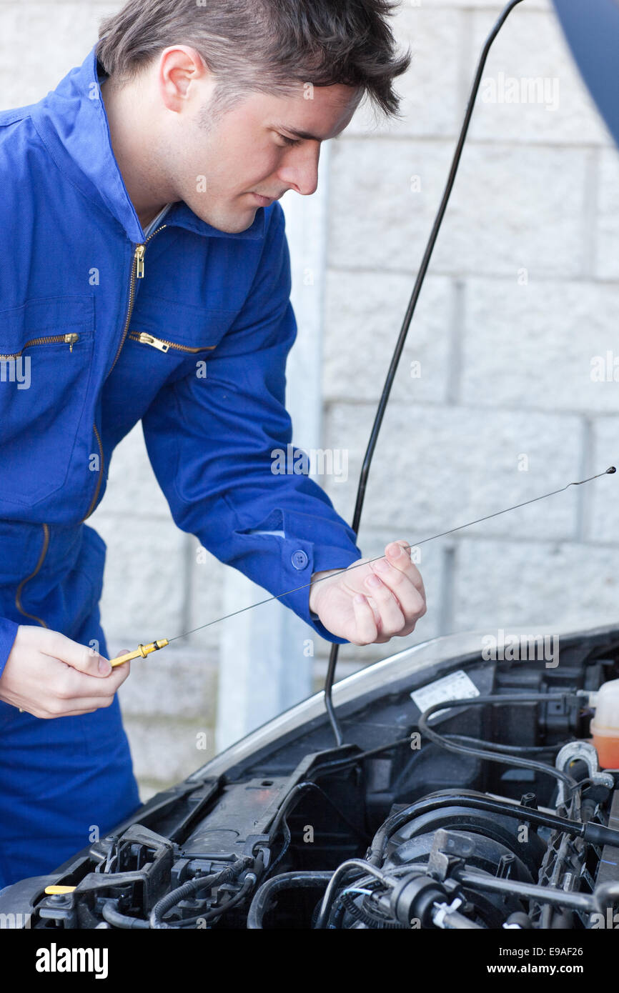 Professional man repairing a car Stock Photo - Alamy