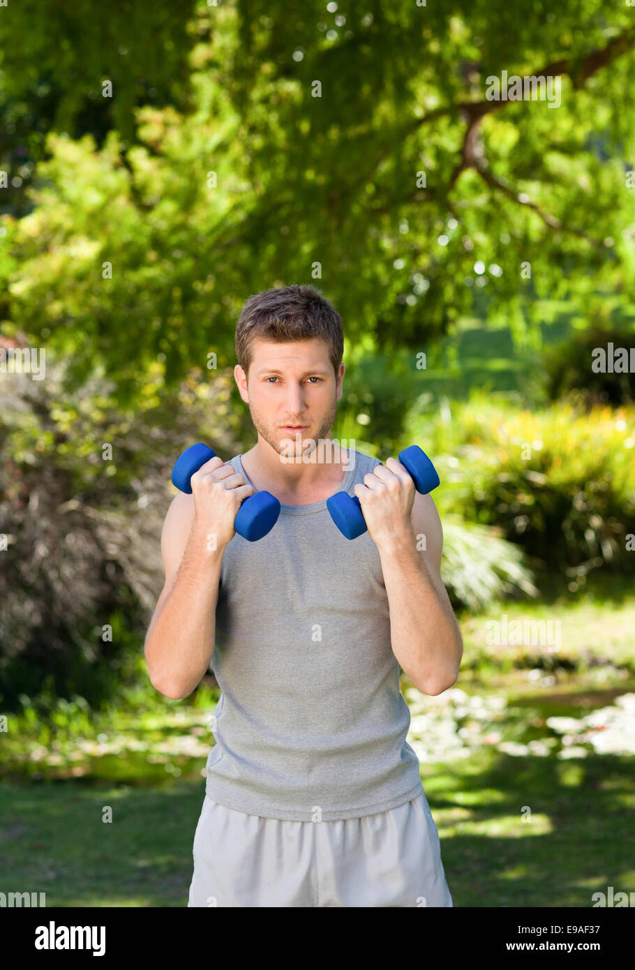 Man doing his exercises in the park Stock Photo - Alamy