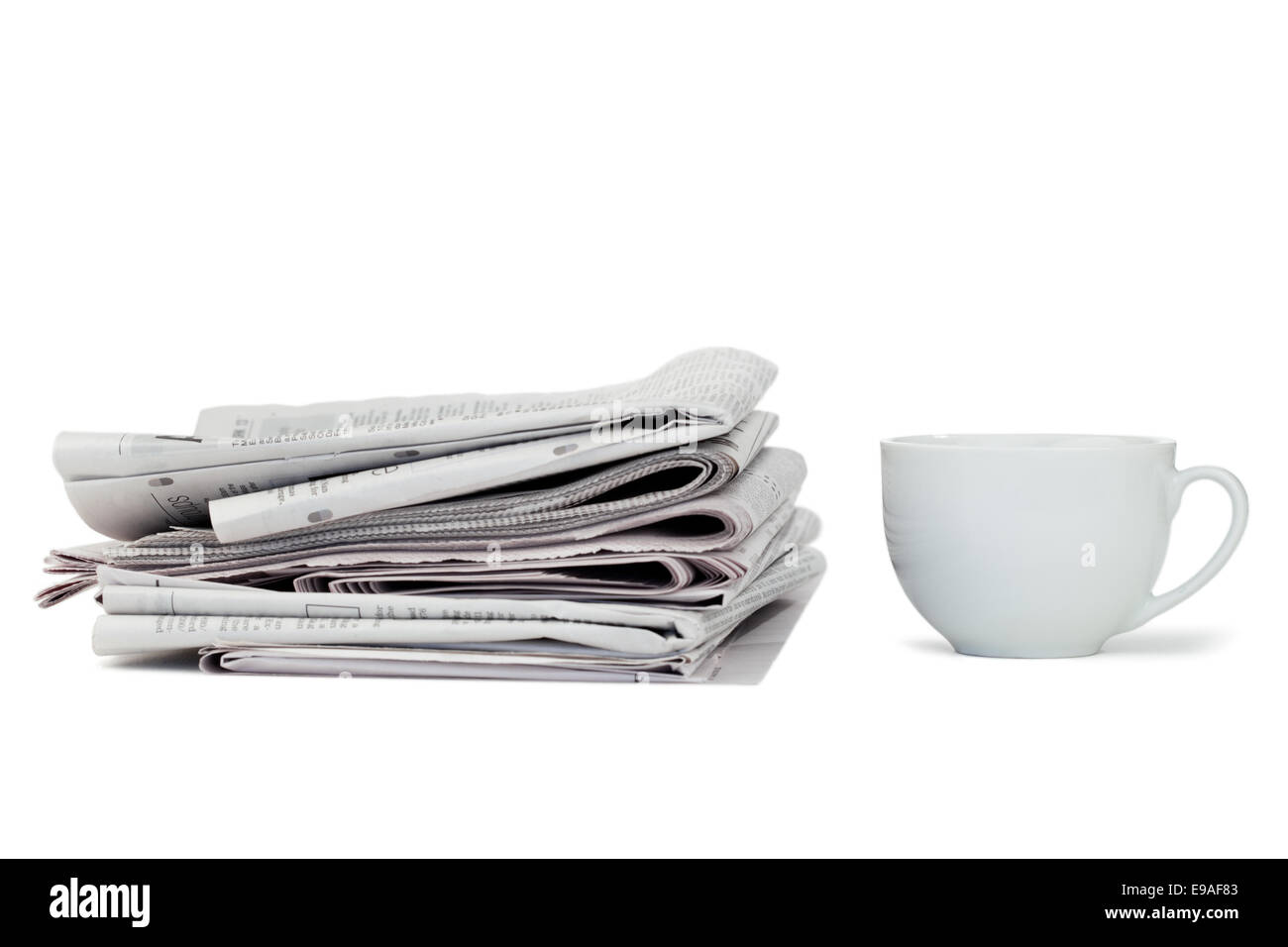 Newspapers and cup of tea Stock Photo - Alamy