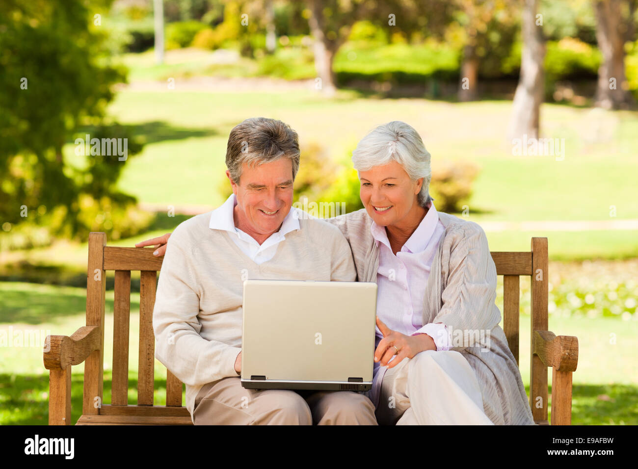Couple working on their laptop Stock Photo - Alamy