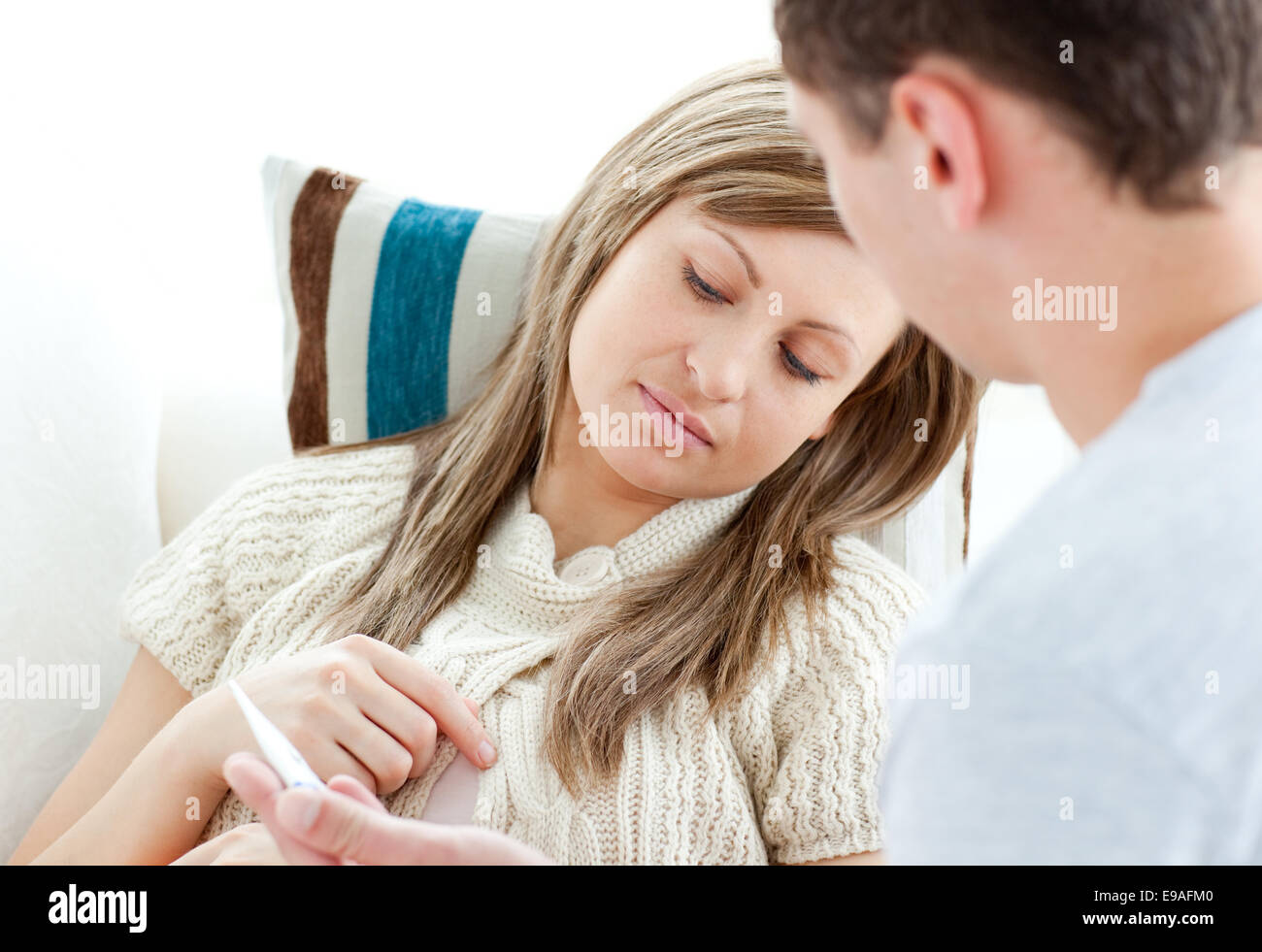 Sad woman in bed taking pills hi-res stock photography and images - Alamy