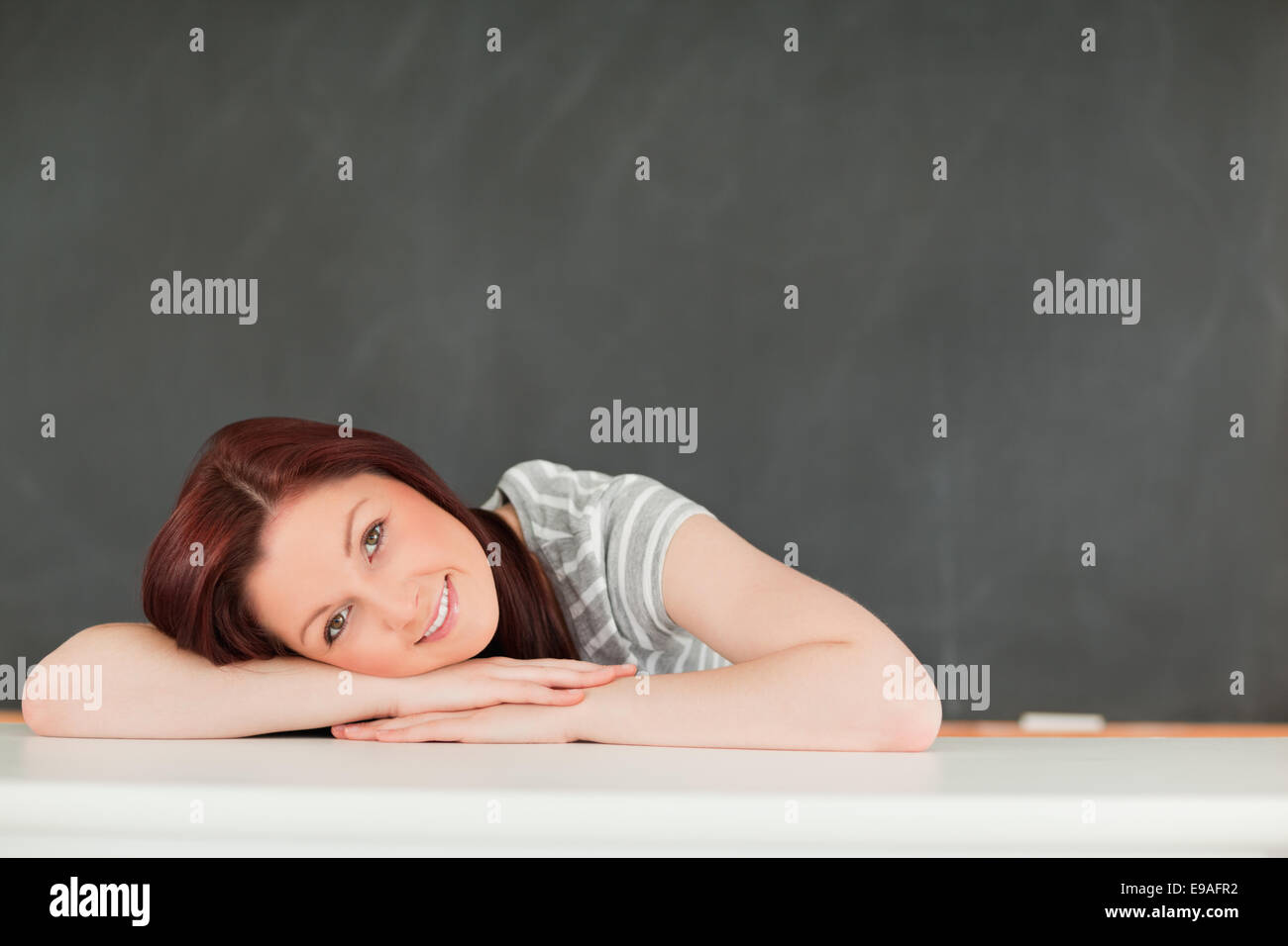 Happy student in a classroom Stock Photo - Alamy