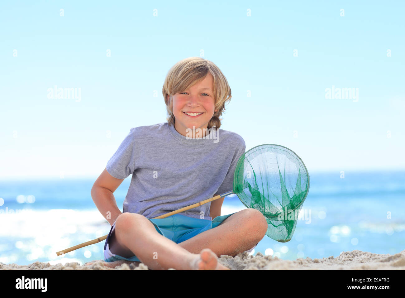 Boy with his fishing net Stock Photo - Alamy