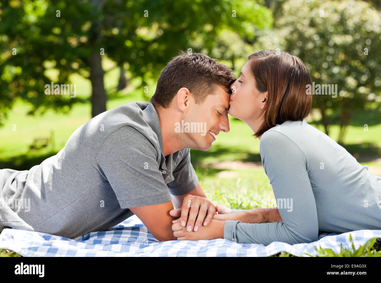 Enamored couple in the park Stock Photo - Alamy
