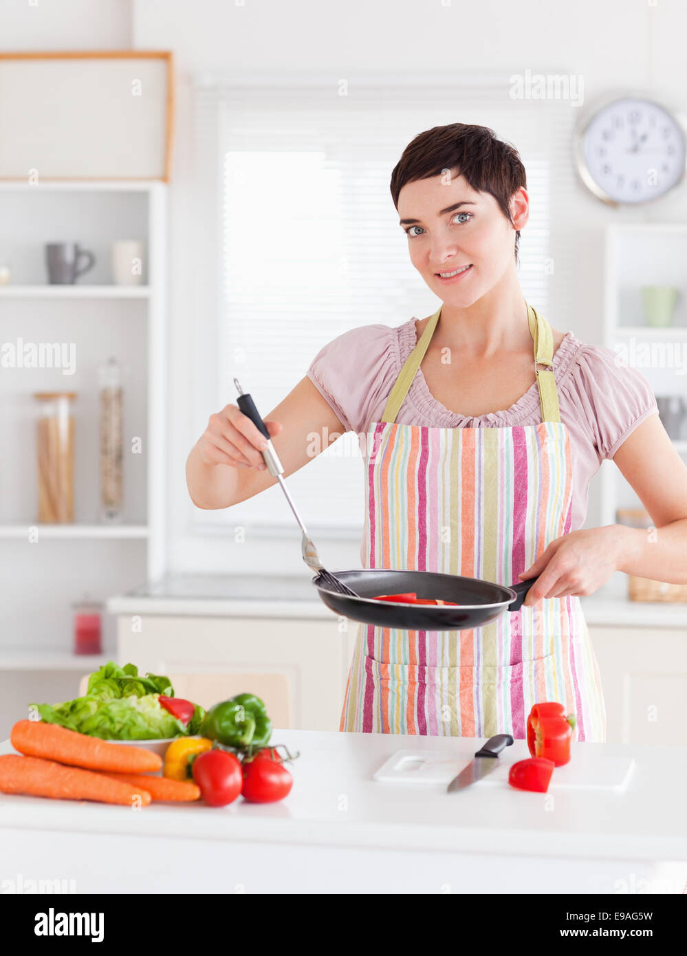 Beautiful woman cooking Stock Photo - Alamy