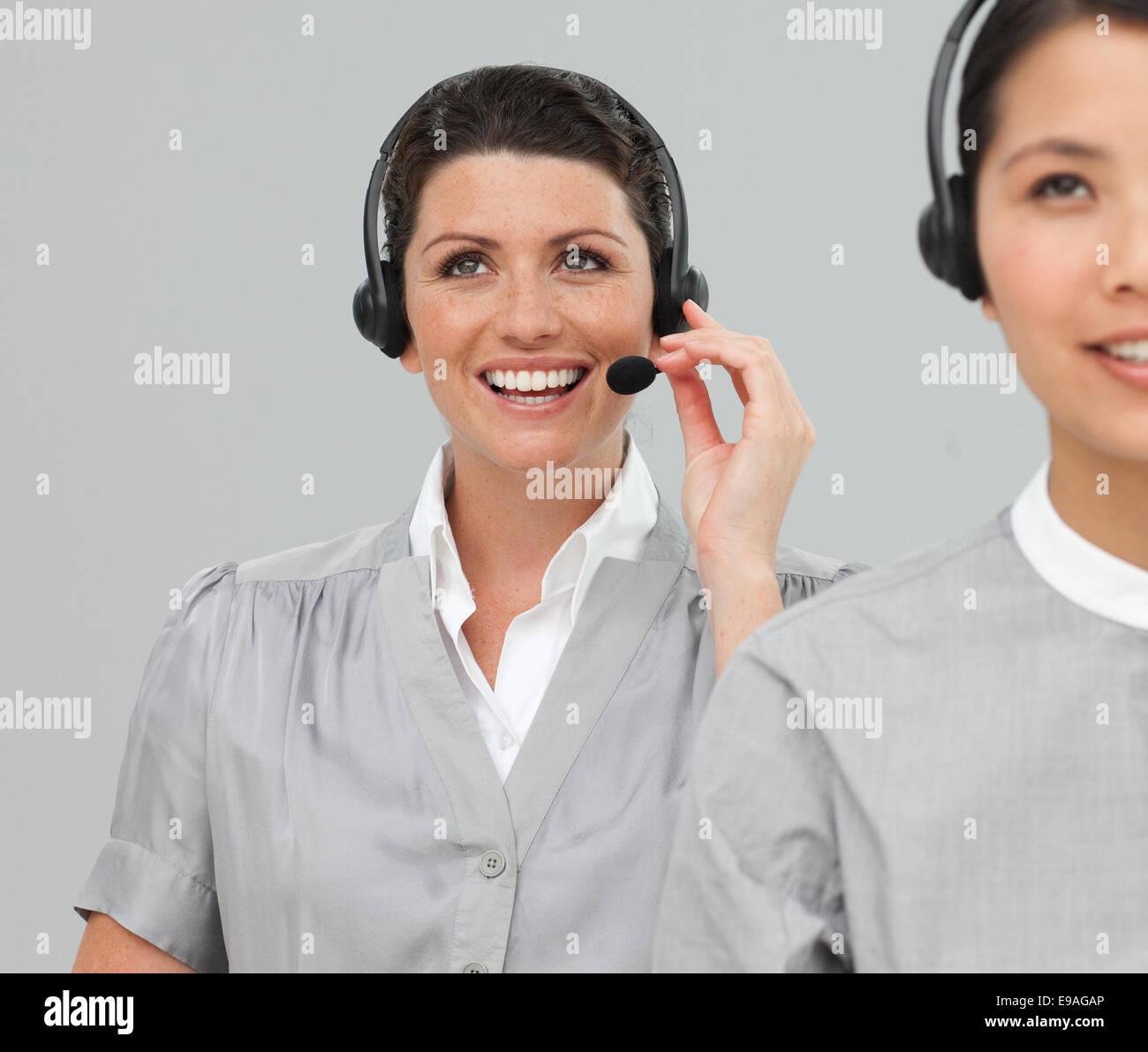 Two Customer service agents with headset on Stock Photo - Alamy