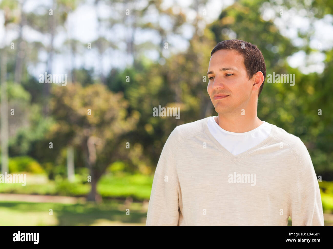 Handsome man in the park Stock Photo - Alamy