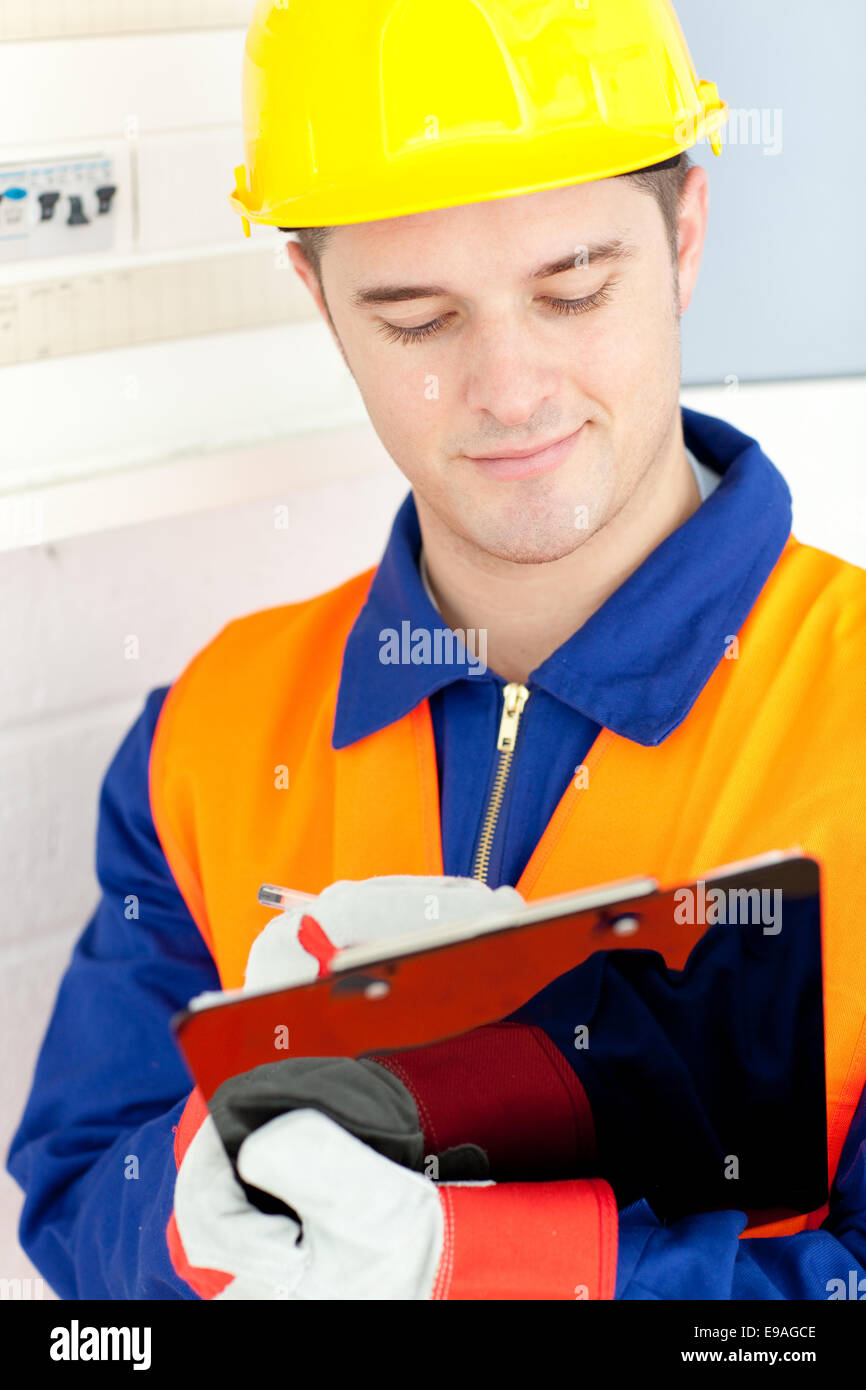 Confident electrician repairing a power plan Stock Photo - Alamy