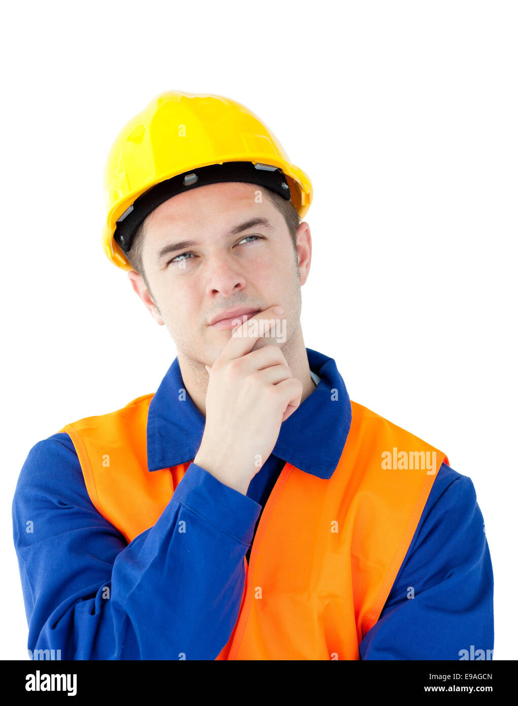 Pensive male worker wearing helmet Stock Photo - Alamy