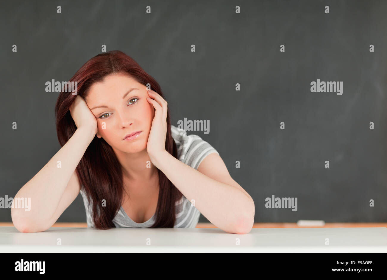 Tired student in a classroom Stock Photo - Alamy