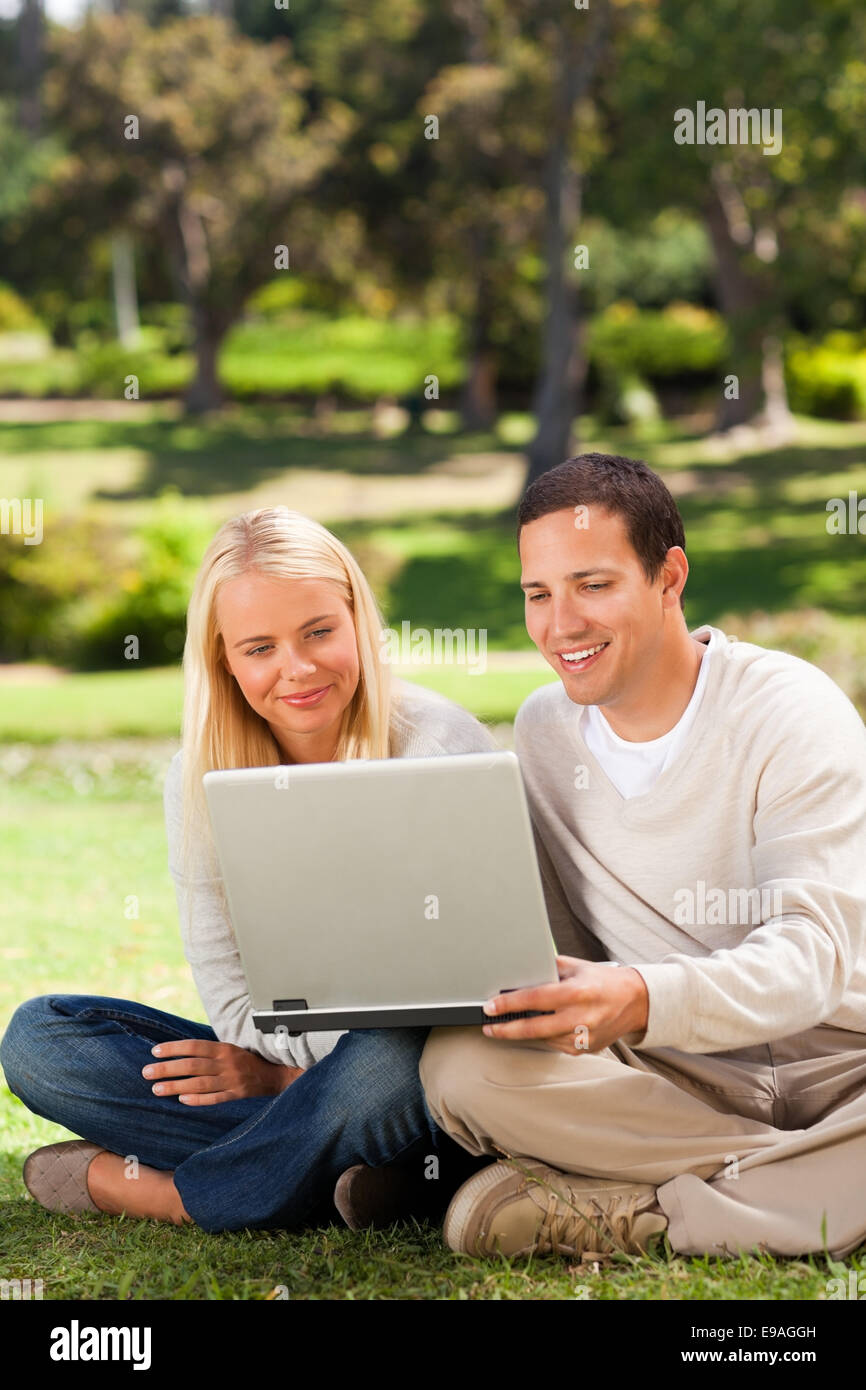 Couple working on their laptop Stock Photo - Alamy