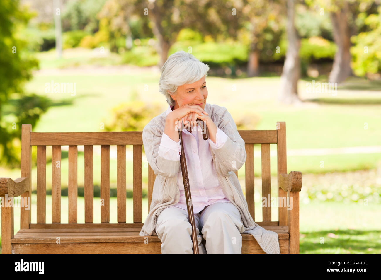 Older woman sitting walking stick hi-res stock photography and images ...