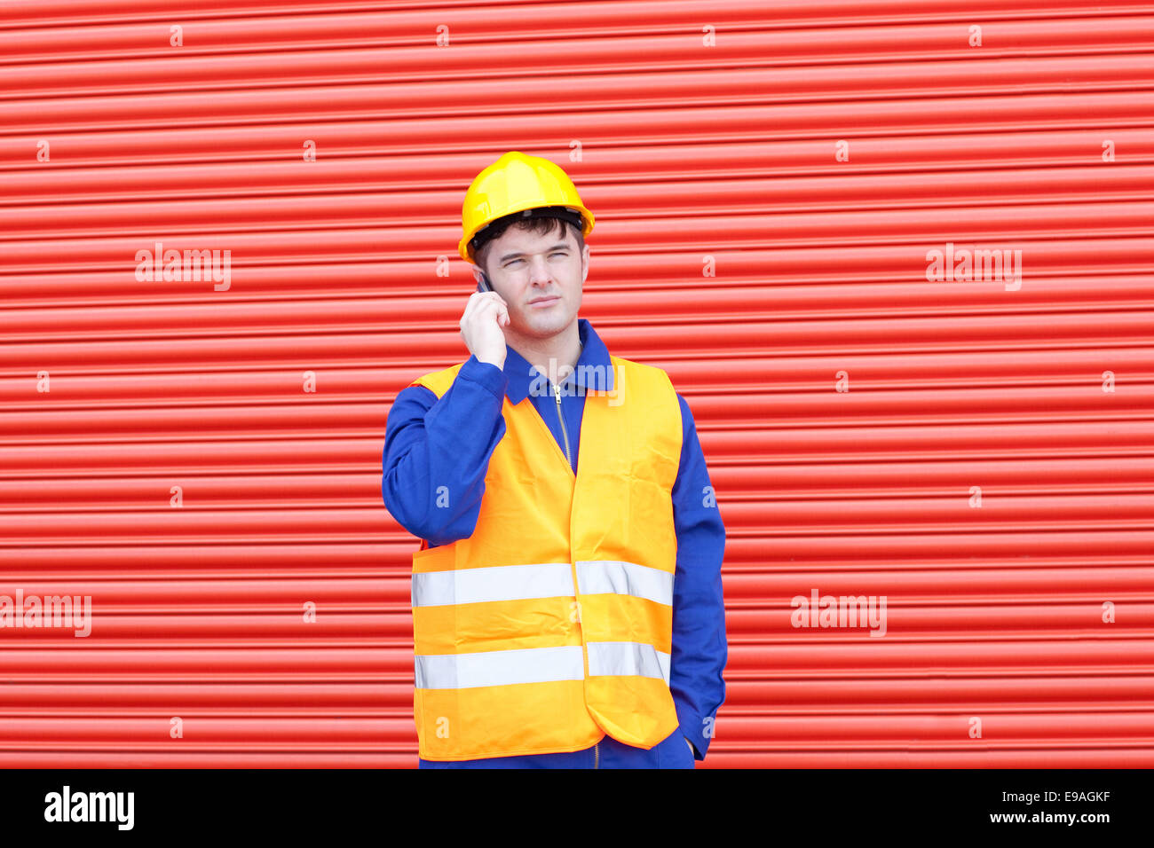 Attractive male engineer standing Stock Photo - Alamy