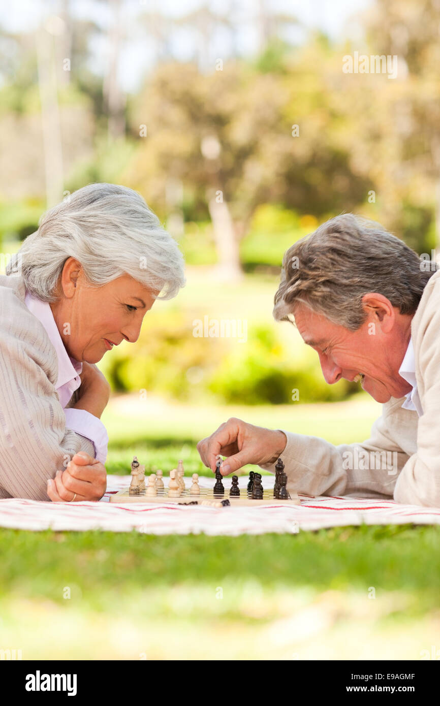 Retired couple playing chess Stock Photo - Alamy