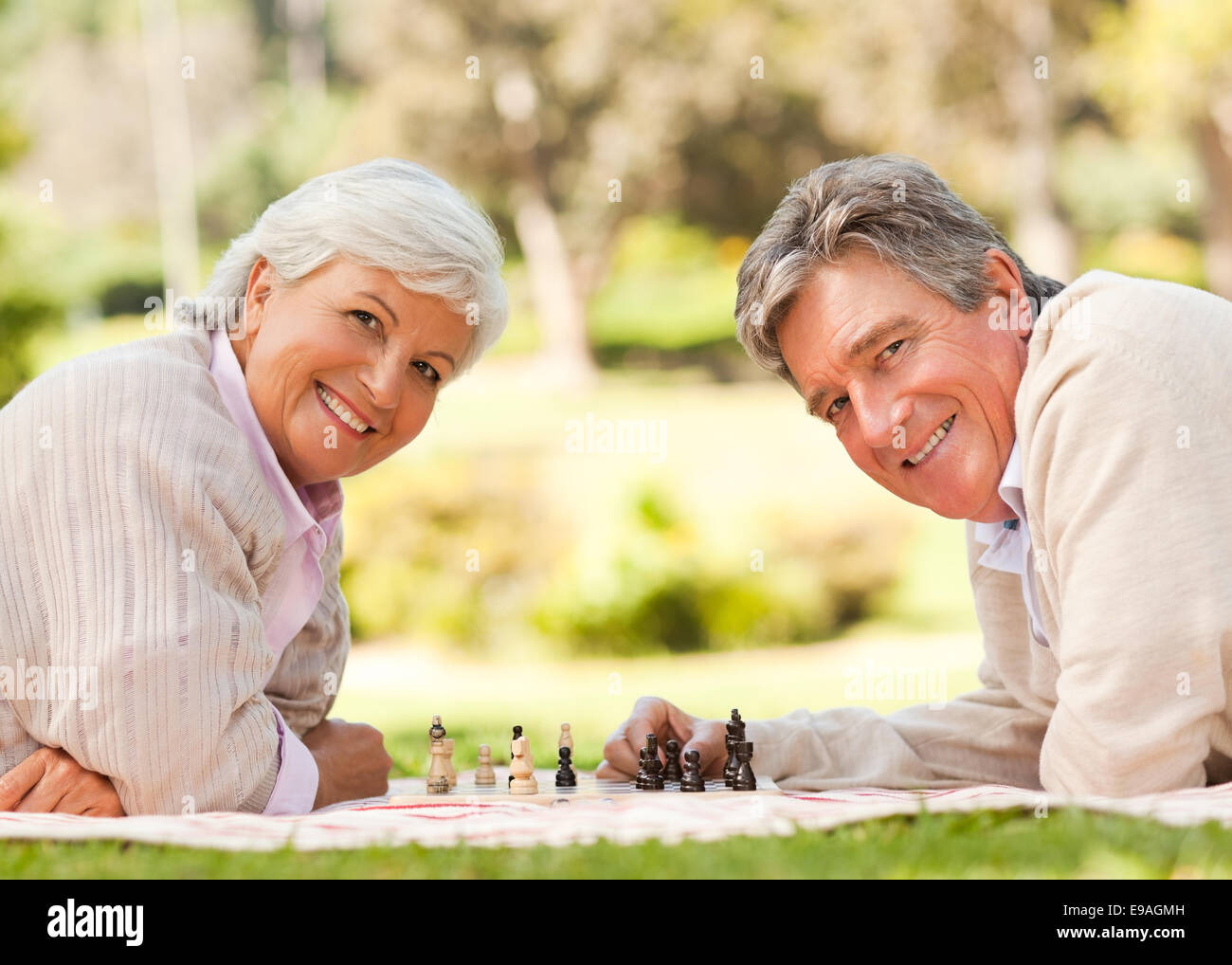Retired couple playing chess Stock Photo - Alamy