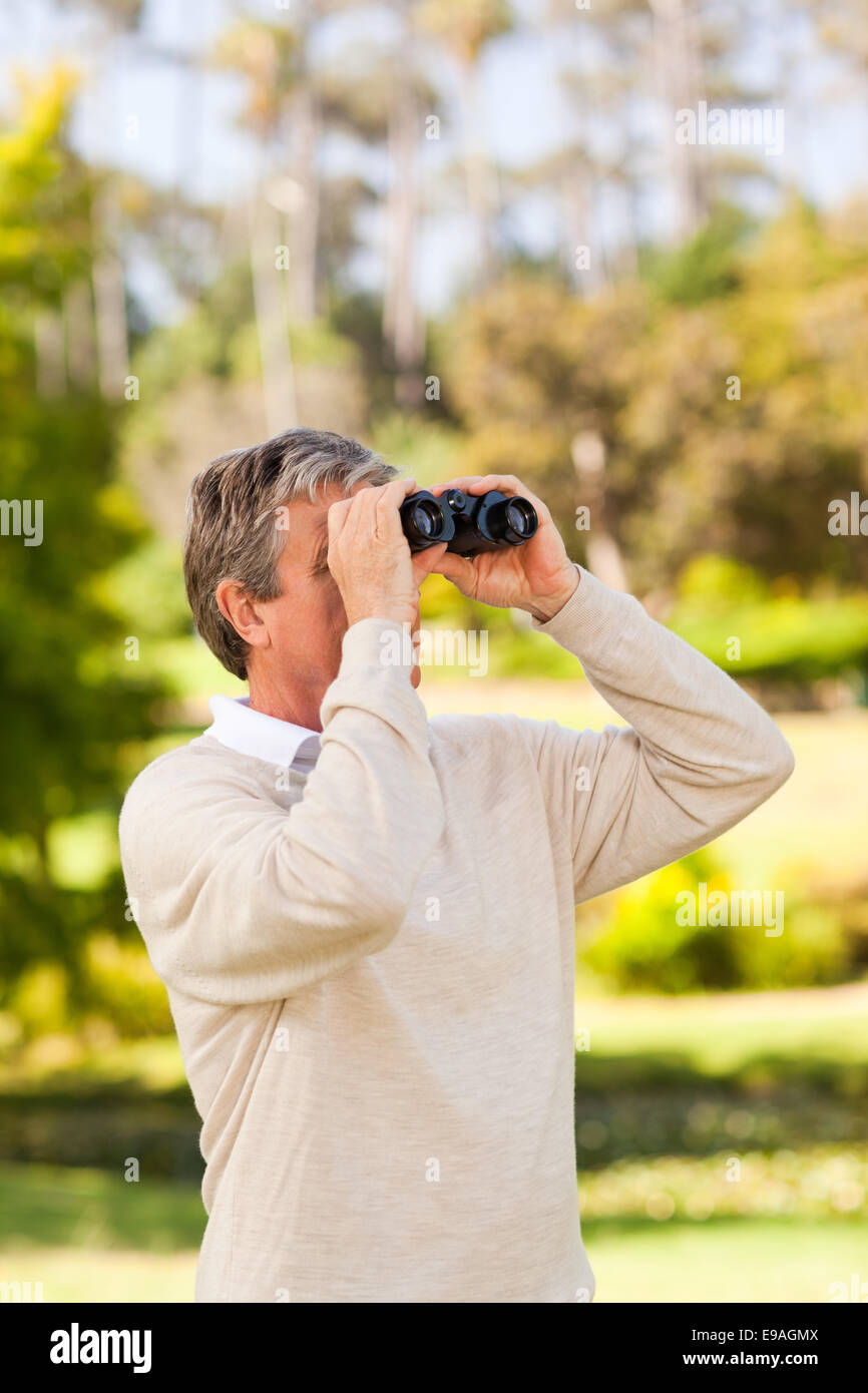 Mature man birds watching Stock Photo - Alamy
