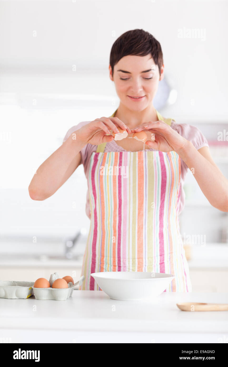 Beautiful woman preparing a cake Stock Photo - Alamy