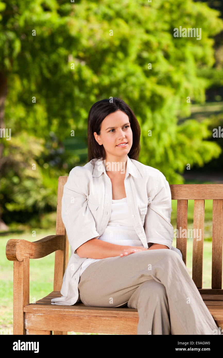 Young woman on the bench Stock Photo - Alamy