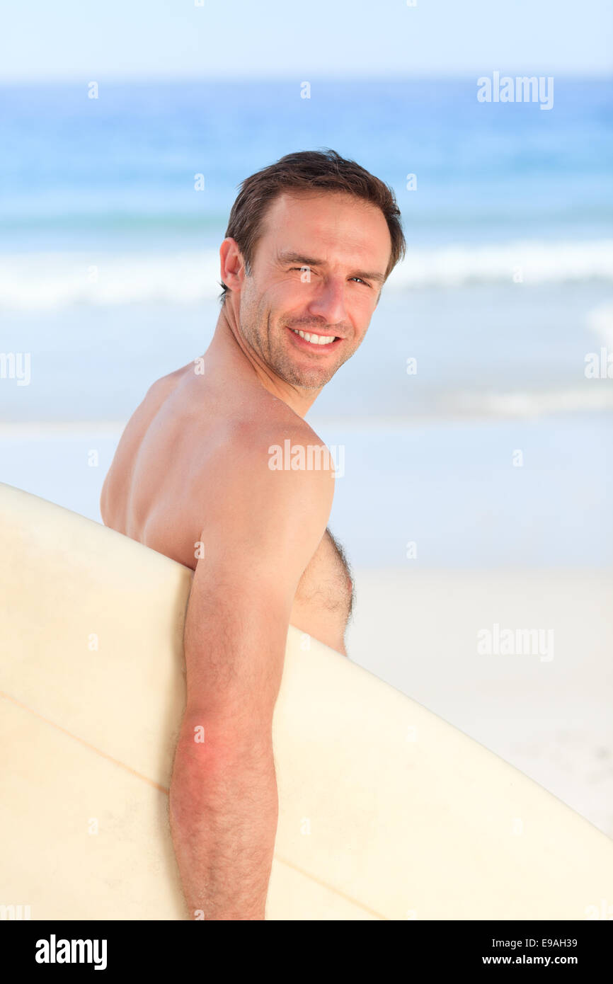 Man with his surfboard Stock Photo - Alamy