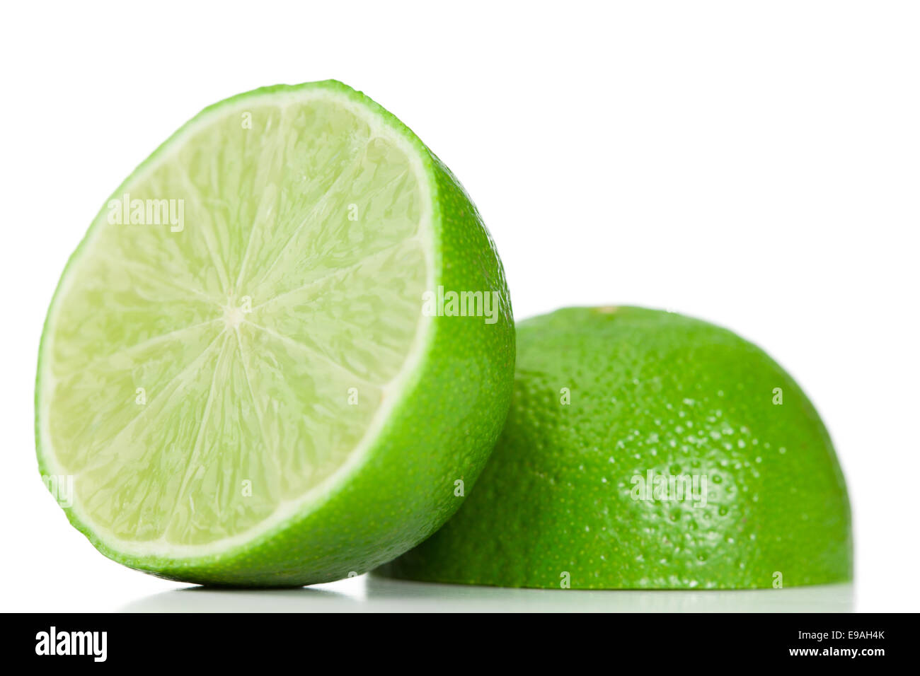 Green halved lemon Stock Photo - Alamy