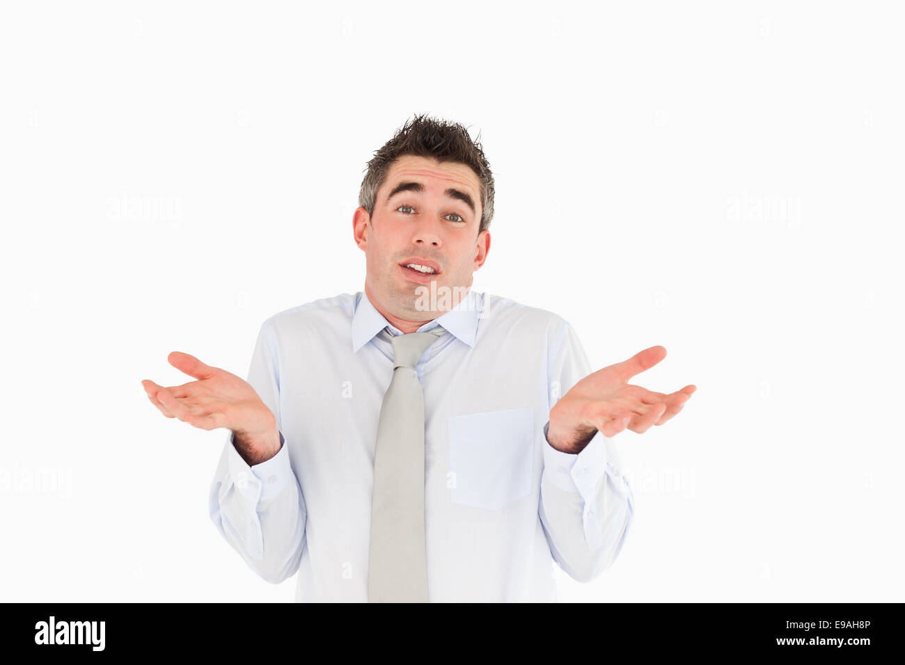 Clueless businessman posing Stock Photo - Alamy
