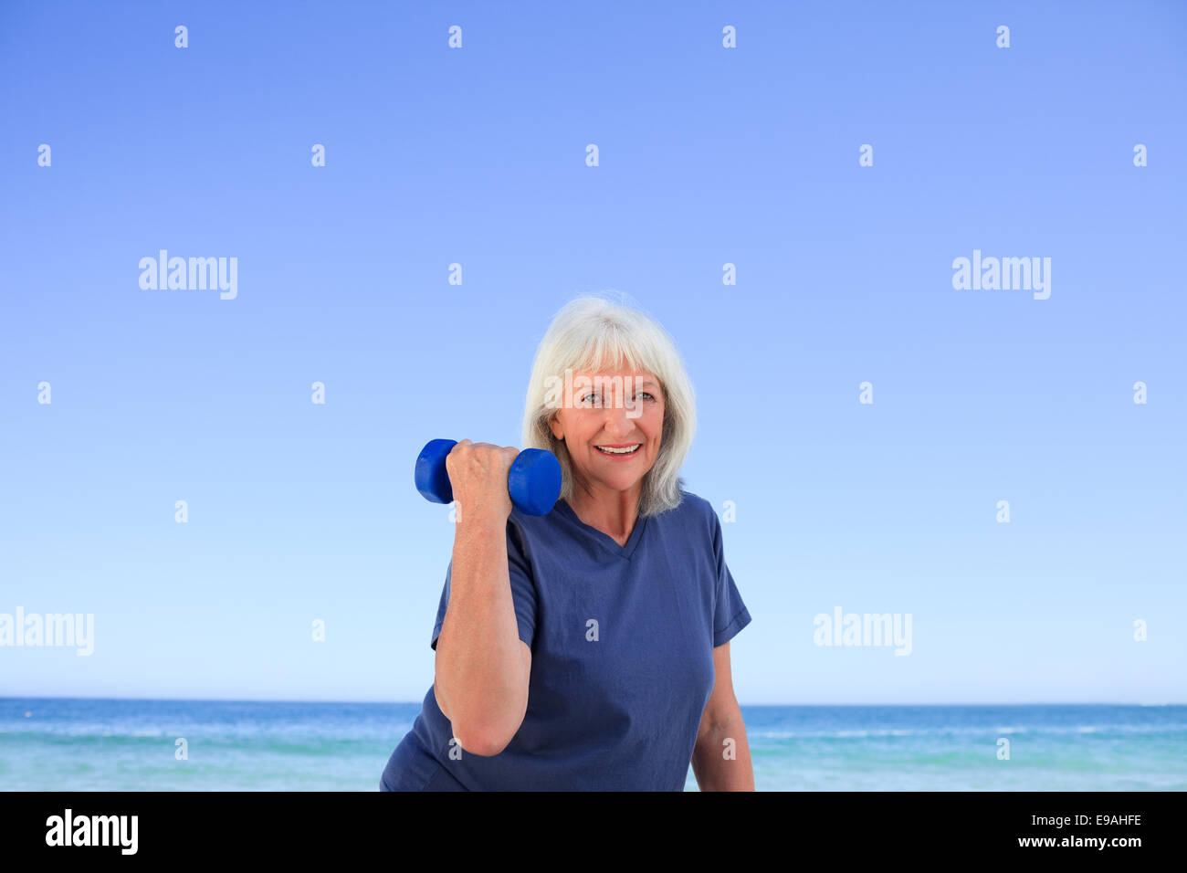 Mature woman doing her exercises Stock Photo - Alamy