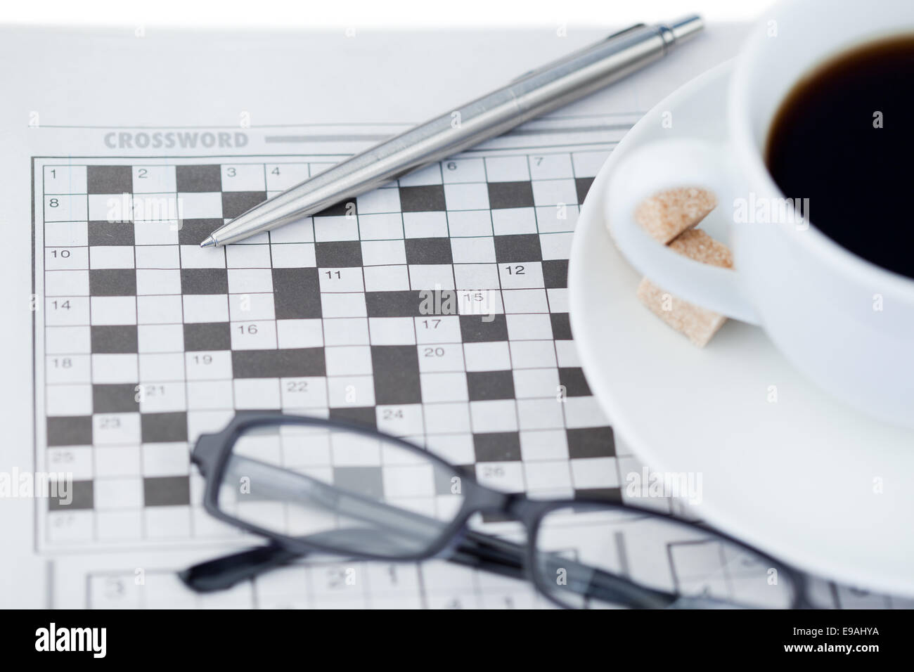 Newspapers and crossword puzzle Stock Photo - Alamy