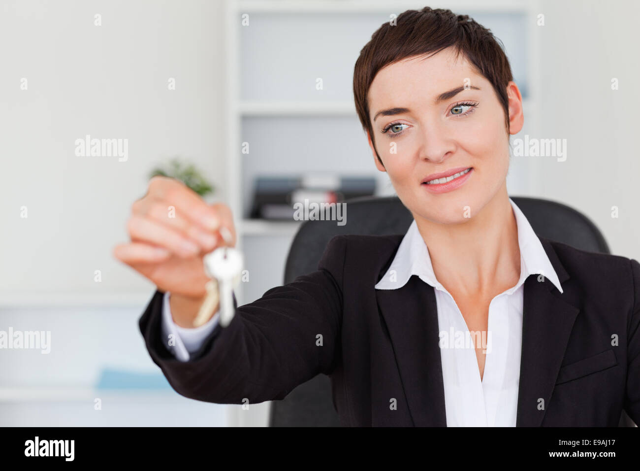 Secretary showing keys Stock Photo - Alamy