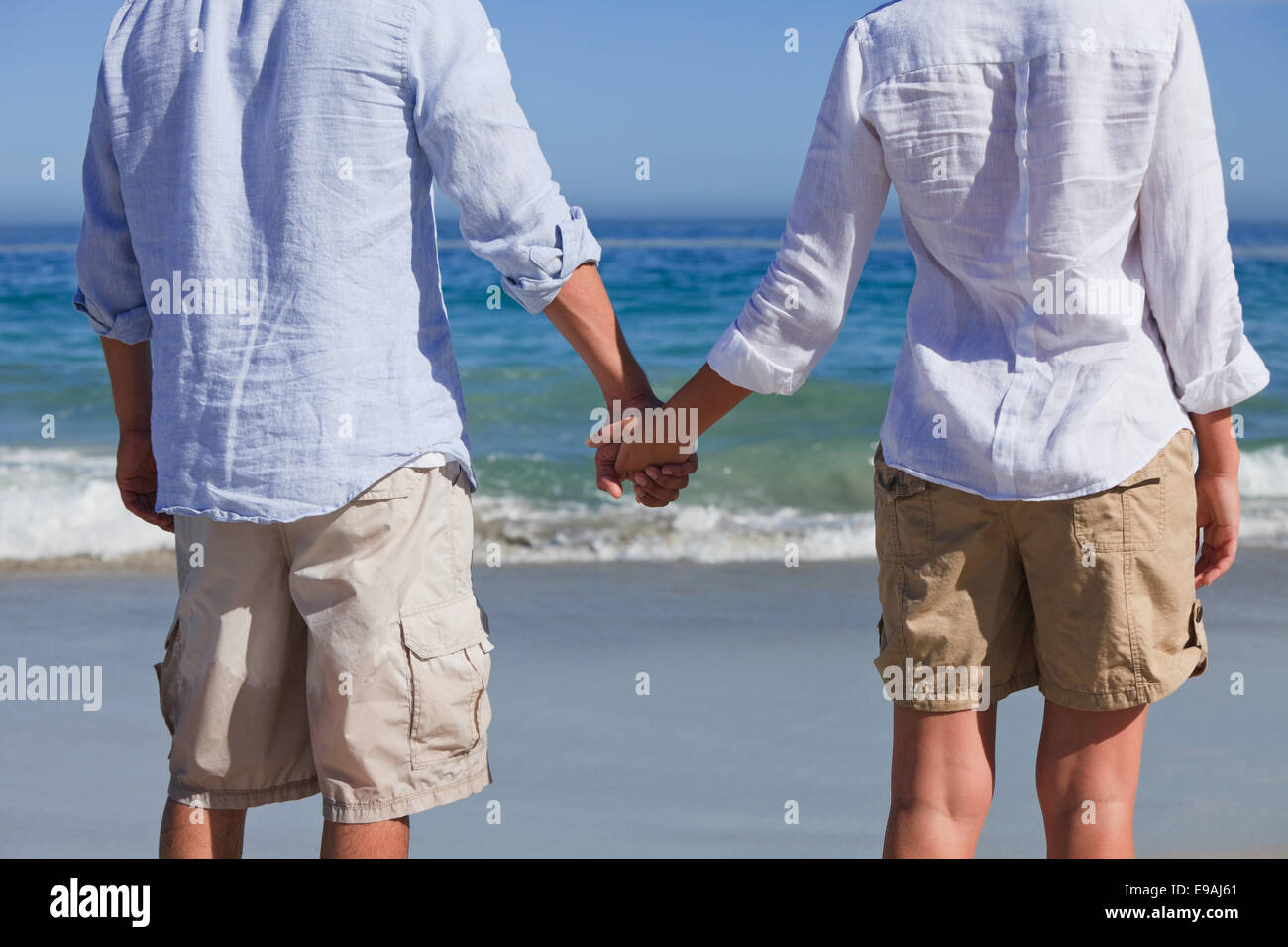 Enamored couple looking at the sea Stock Photo - Alamy