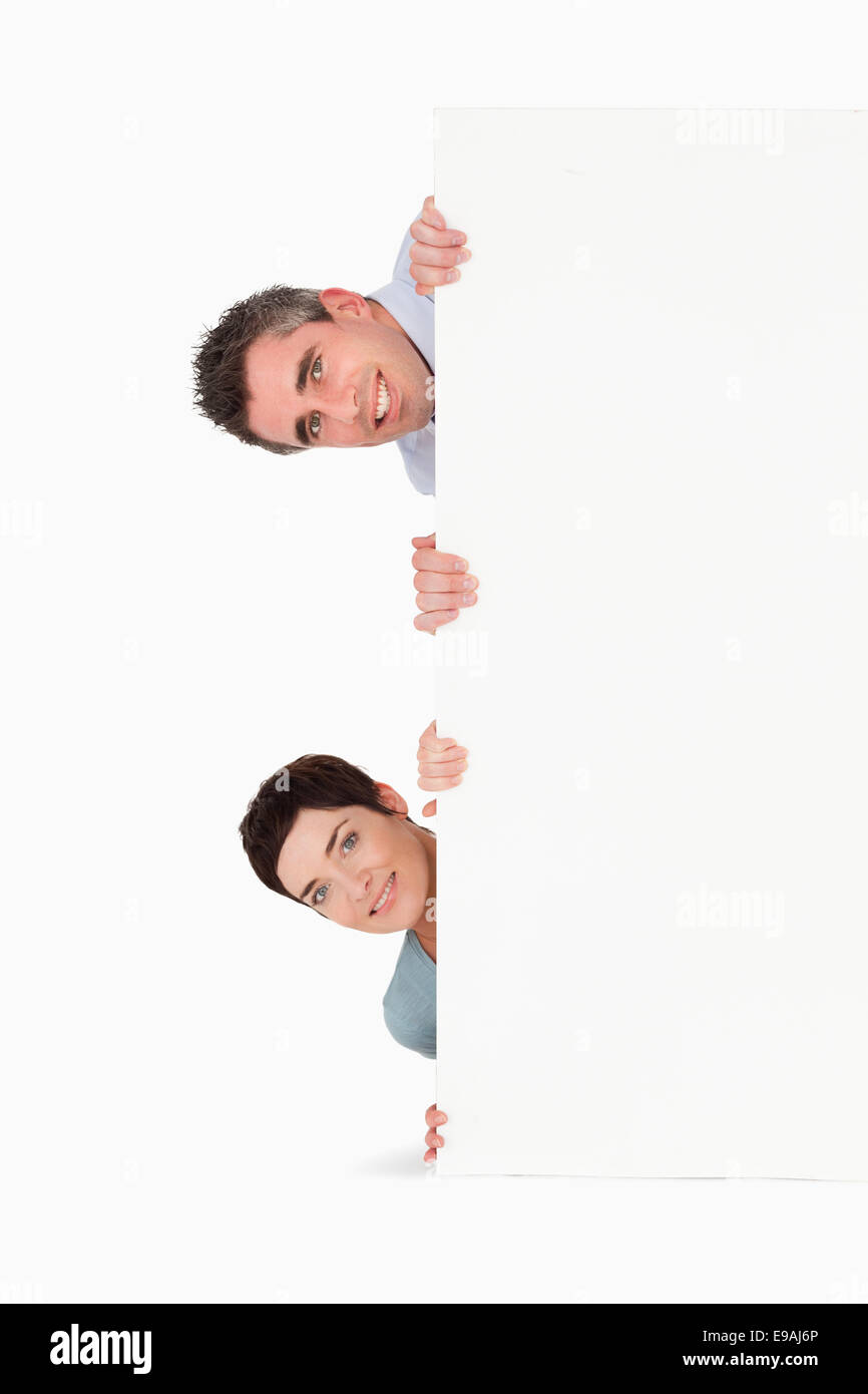 Beautiful brunette woman hiding Cut Out Stock Images & Pictures - Alamy