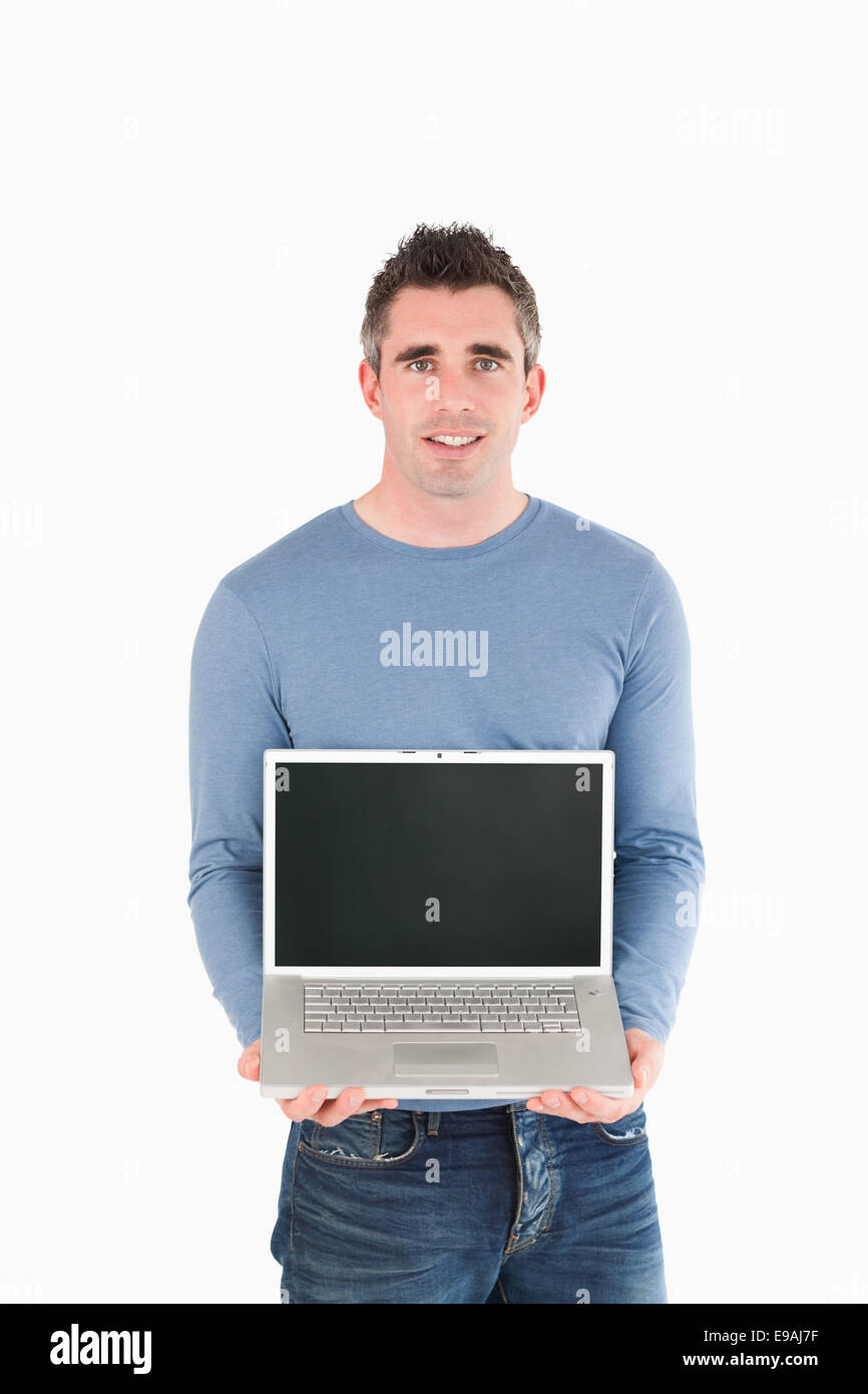 Man showing a laptop Stock Photo - Alamy
